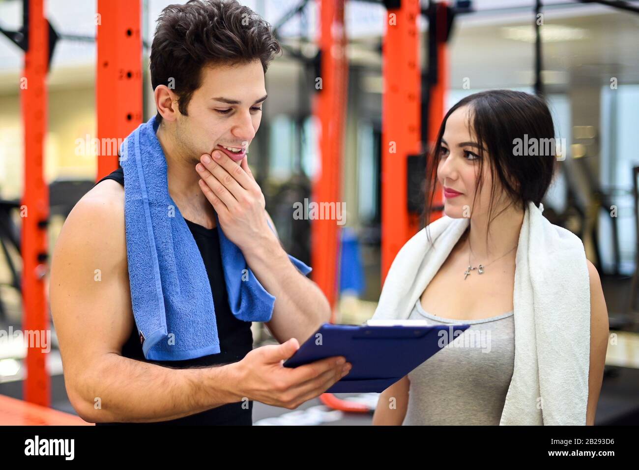 Woman and personal trainer talking hi-res stock photography and images ...