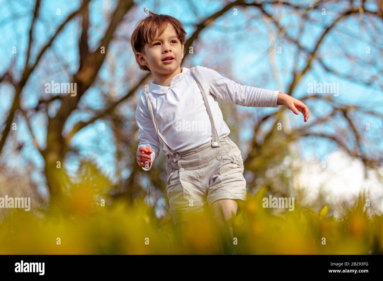 Boy playing outside hi-res stock photography and images - Alamy