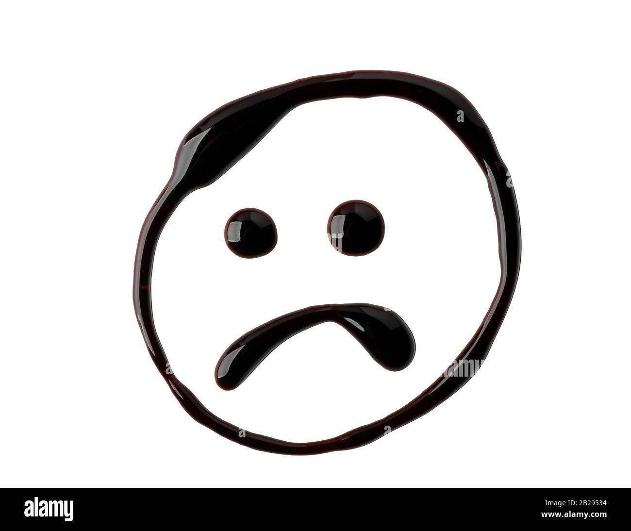 Sad smile painted with chocolate syrup, isolated on white background ...