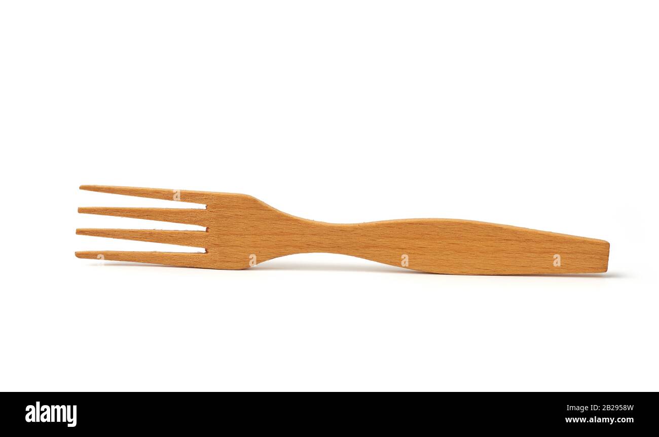 wooden yellow fork isolated on white background, vintage appliance ...