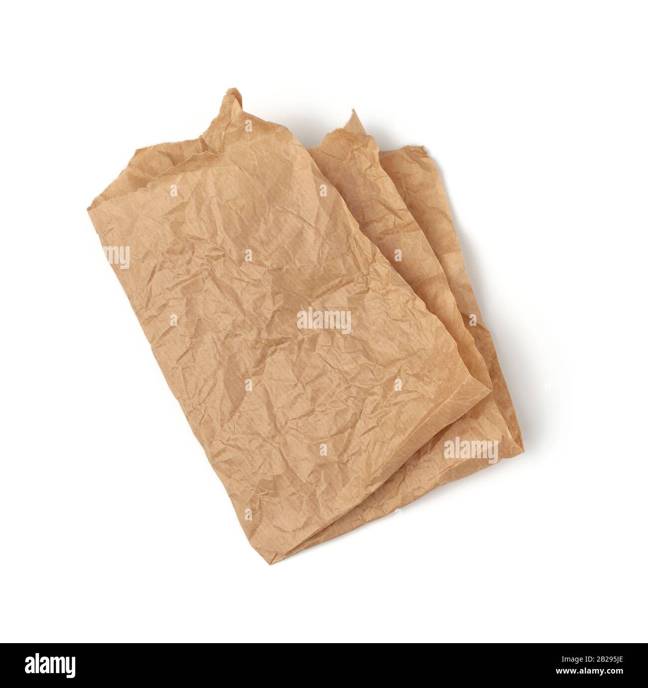 folded piece of crumpled brown paper isolated on white background ...