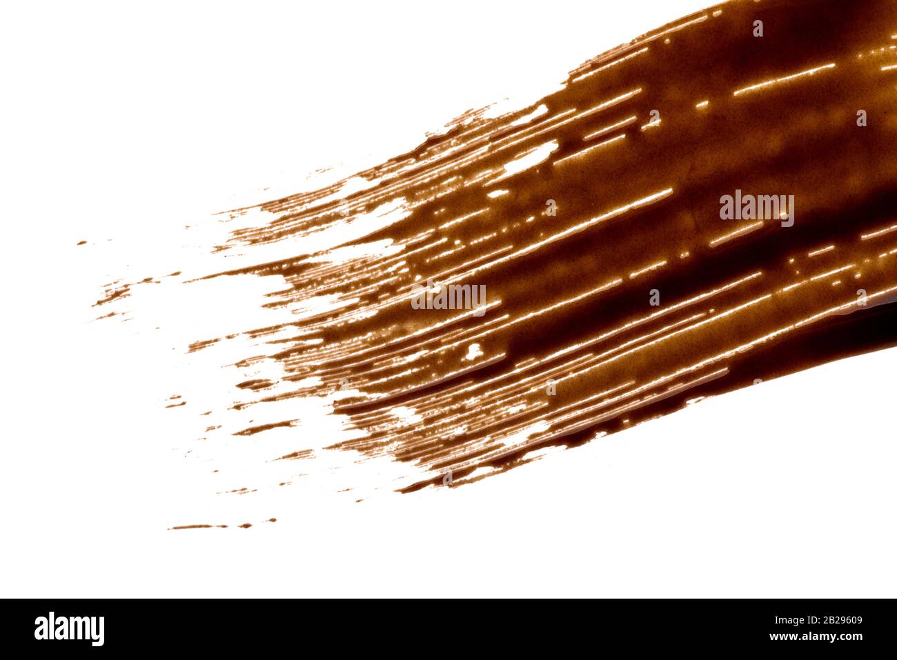 Stroke of melted chocolate on white background Stock Photo - Alamy