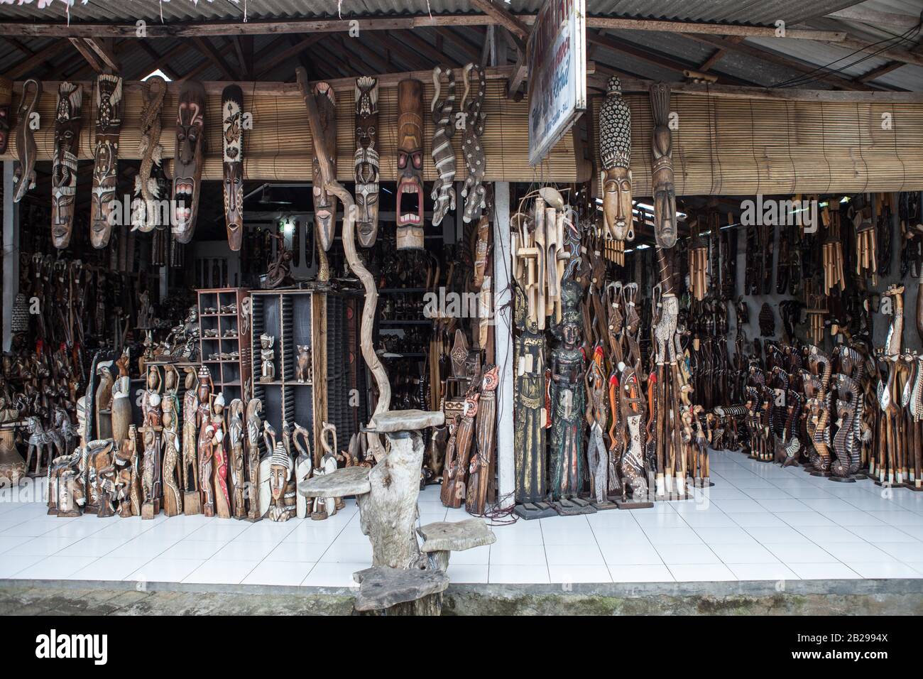 INDONESIA, BALI - JANUARY 20, 2011: Balinese shops with handmade wood ...