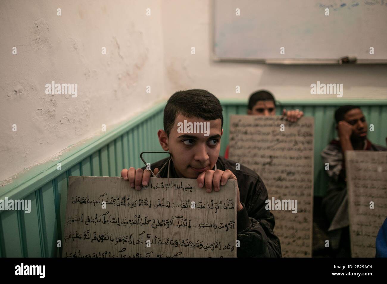 Tripoli, Libya. 1st Mar, 2020. Libyan boys hold traditional wooden ...