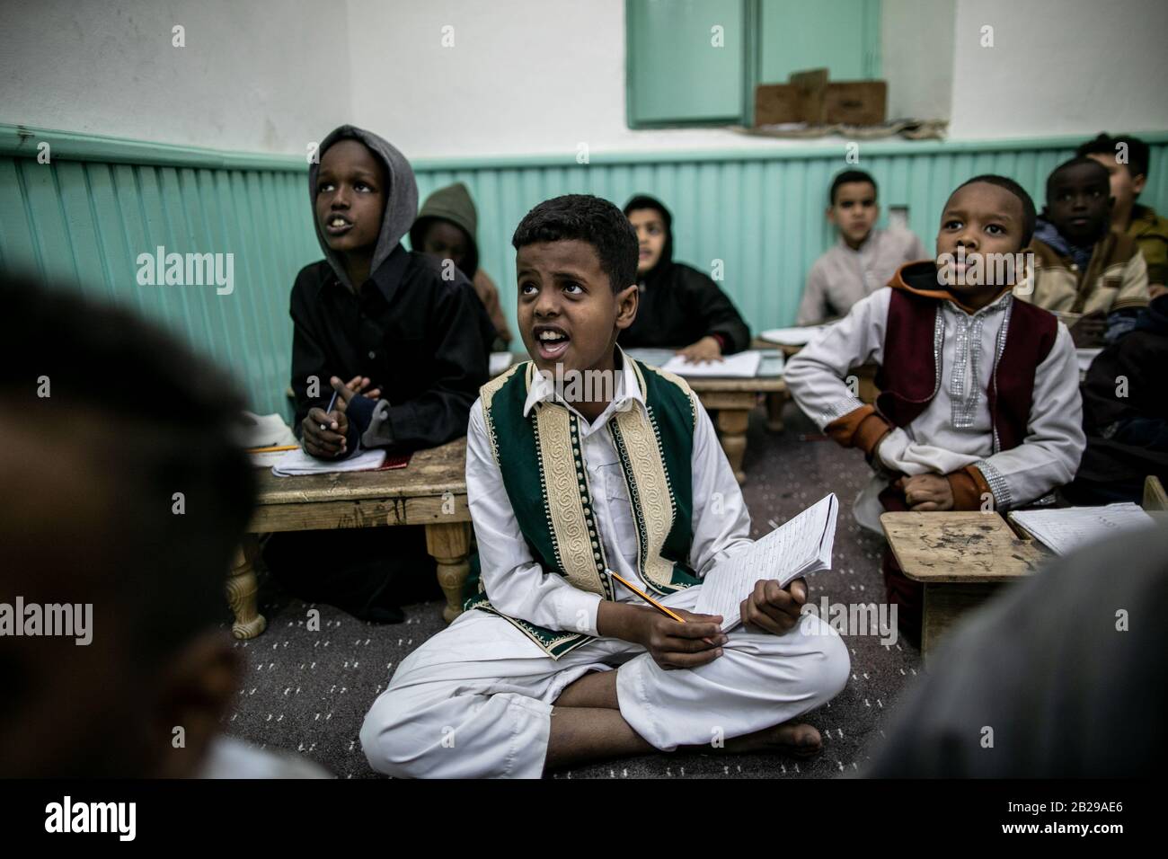 Tripoli, Libya. 1st Mar, 2020. Libyan boys read Arabic poetry at Uthman ...