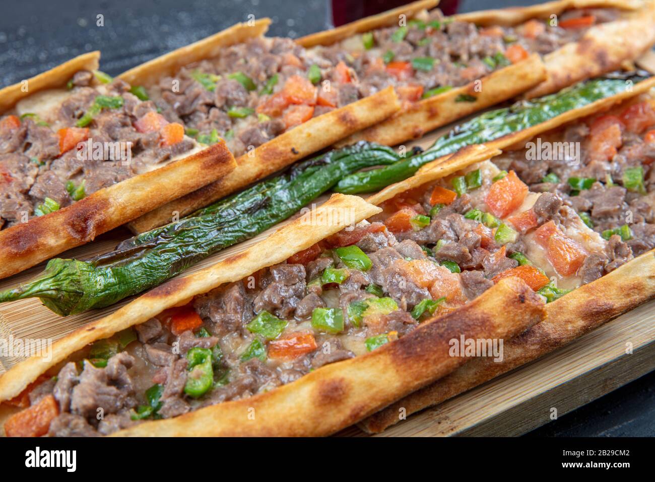 Traditional Turkish dish pita beef - Kusbasili Pide. Turkish Pide with ...