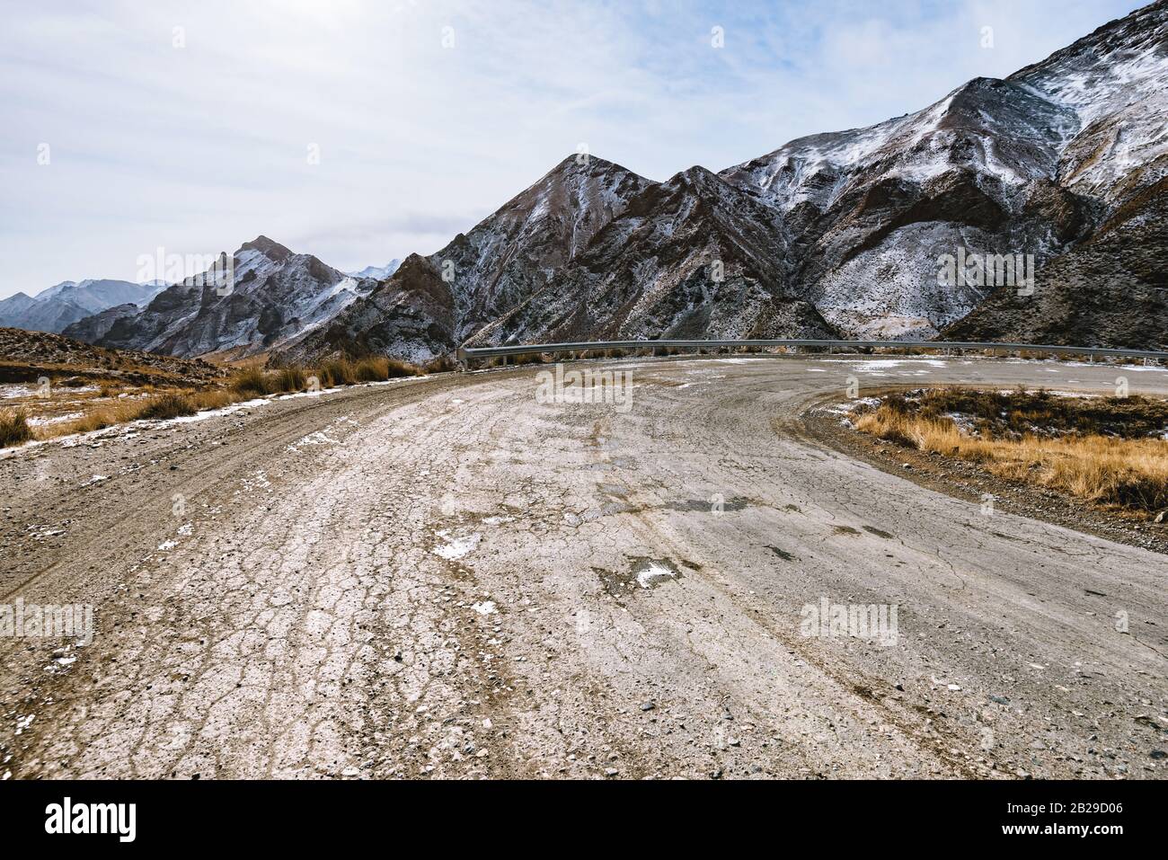 the gravel road on the snow mountain Stock Photo - Alamy
