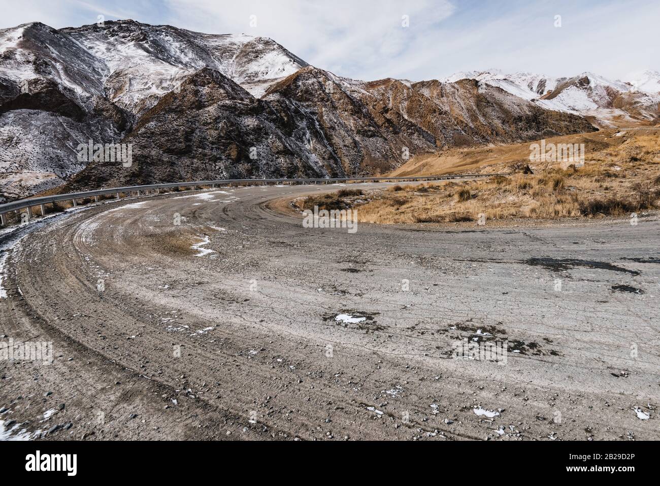 the gravel road on the snow mountain Stock Photo - Alamy