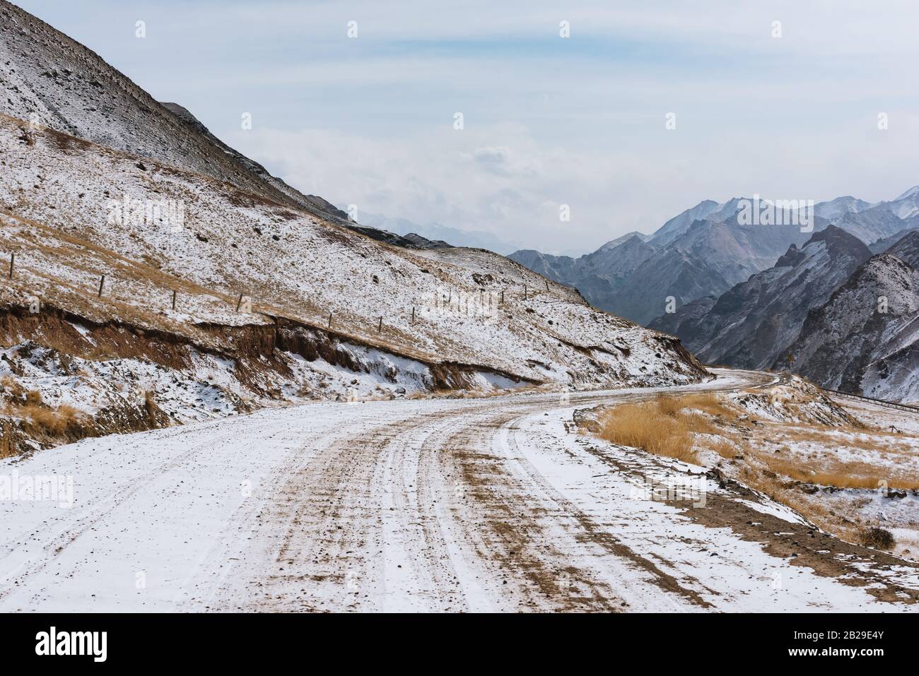 the gravel road on the snow mountain Stock Photo - Alamy
