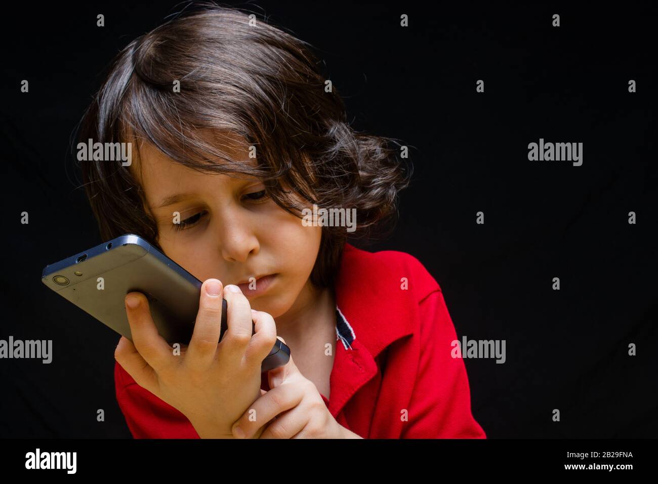 Little boy hold smartphone as modern mobile communication gadget Stock ...