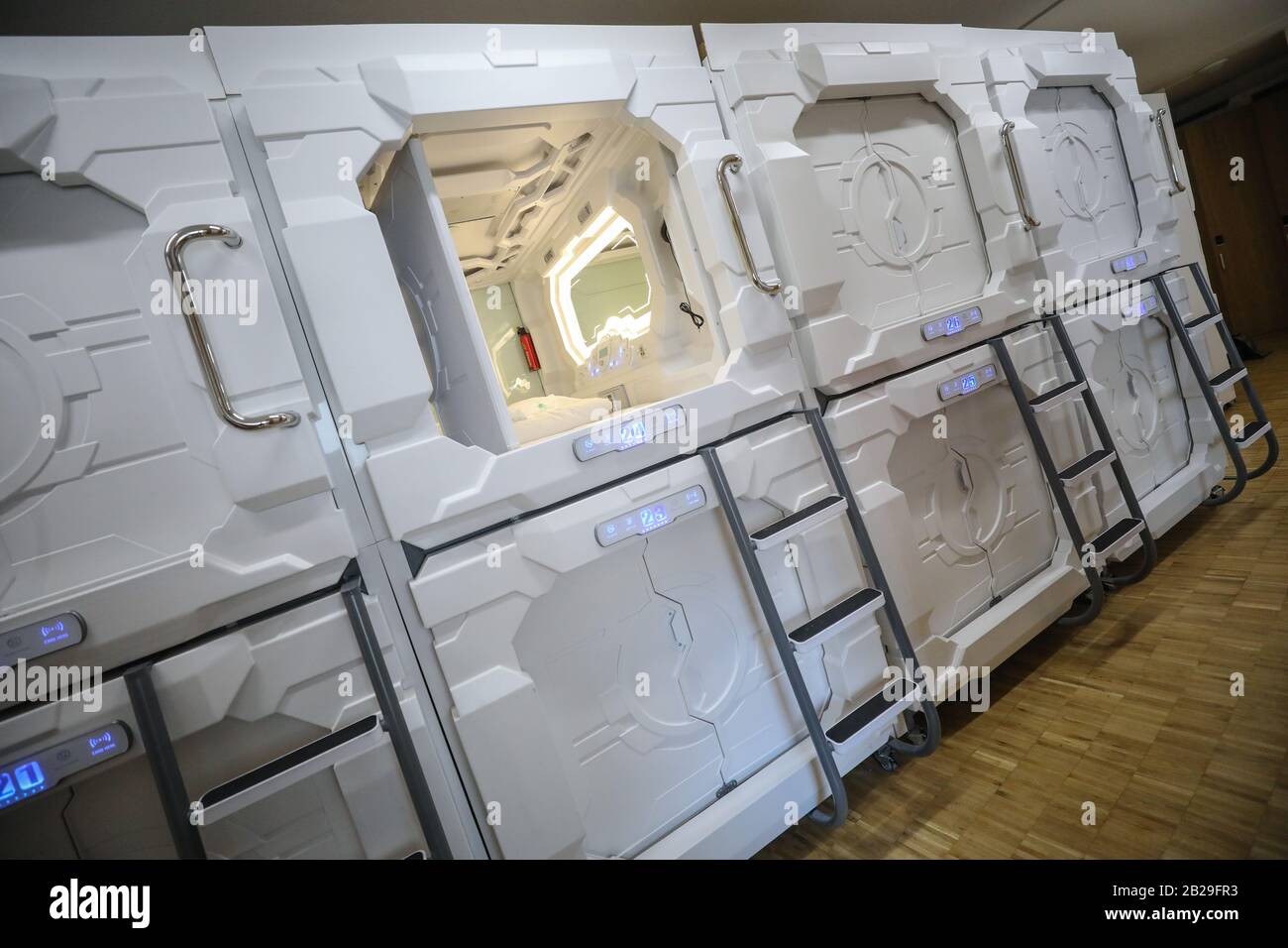 Sleeping capsules in capsule hotel hi-res stock photography and images ...