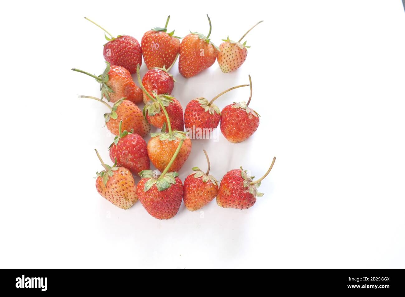 word " E " made from strawberries on white background for design. Card ...