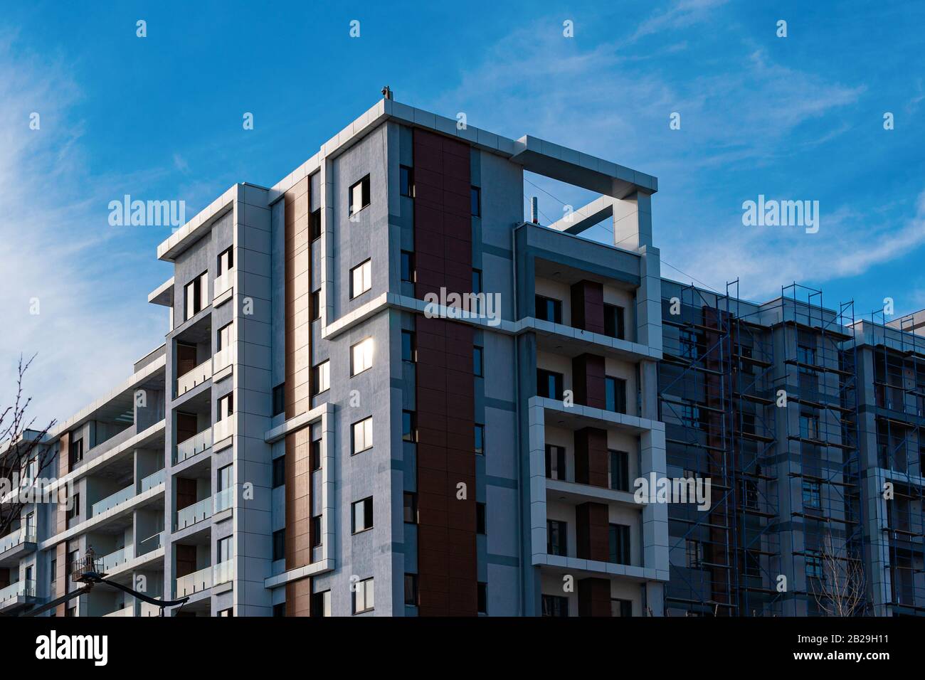 Modern apartments building at finishing stage. Modern architecture ...