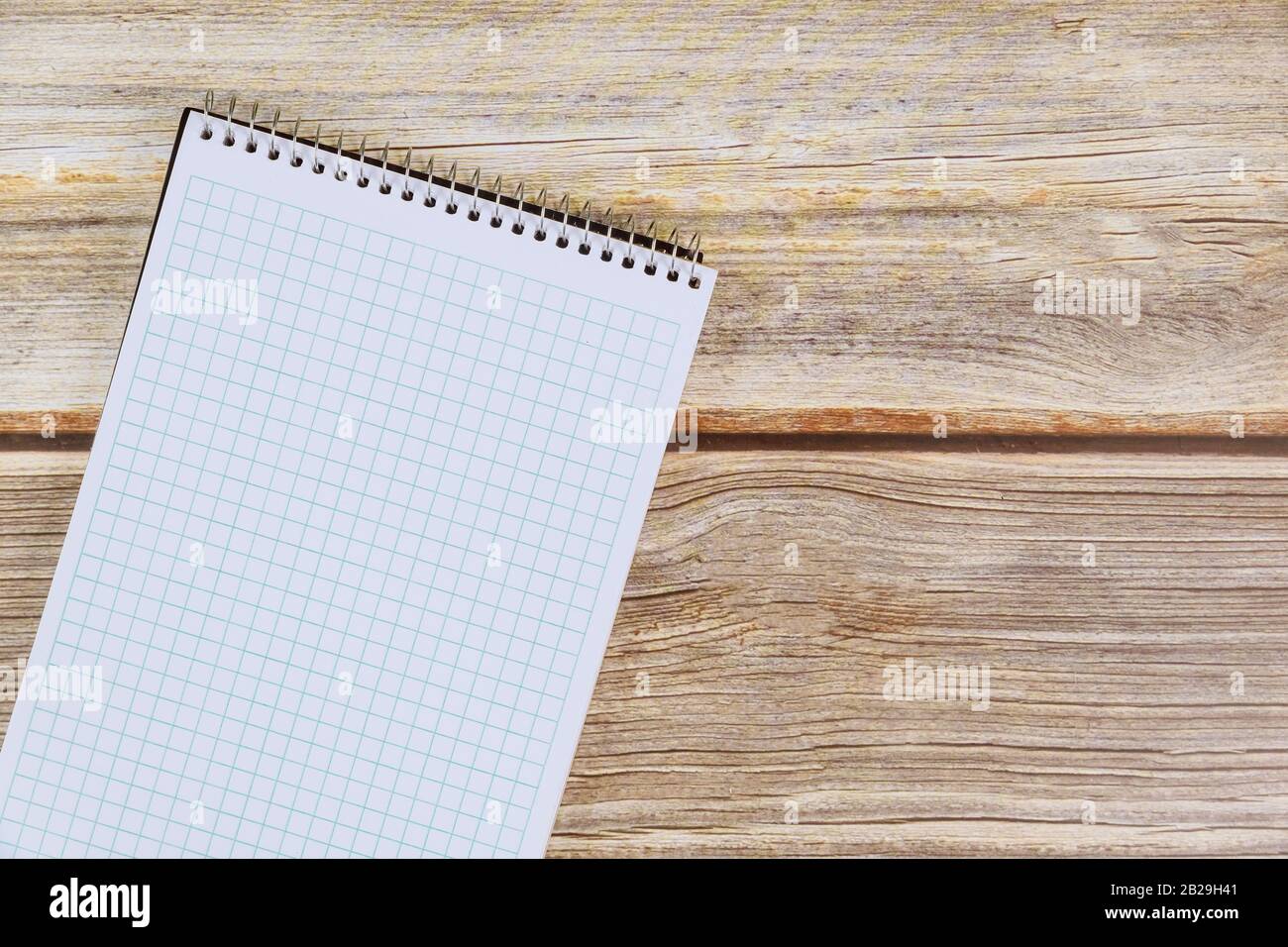 Blank spiral notebook empty white paper page on wood background Stock ...
