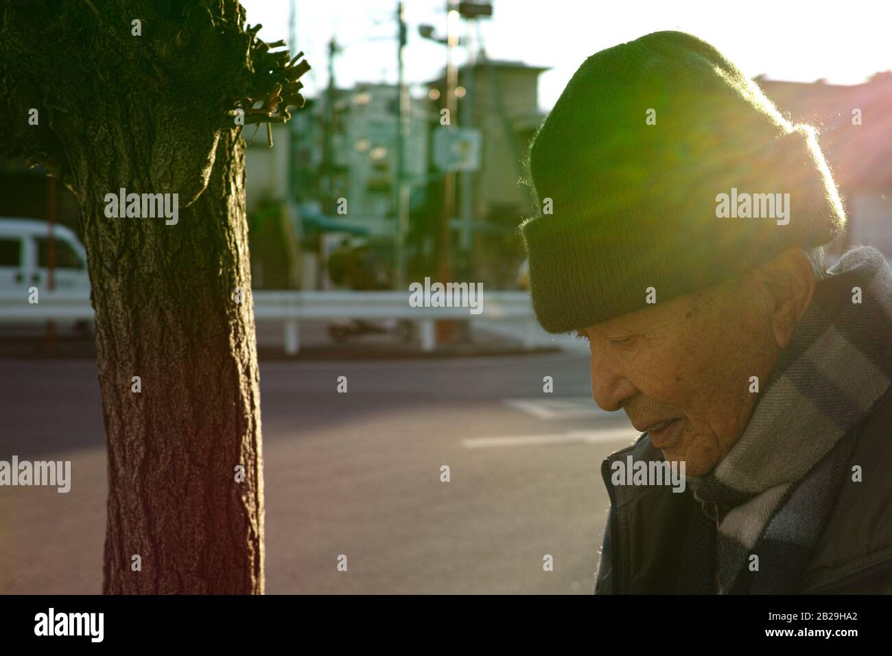 An old Asian man walking down the road in Winter Stock Photo - Alamy