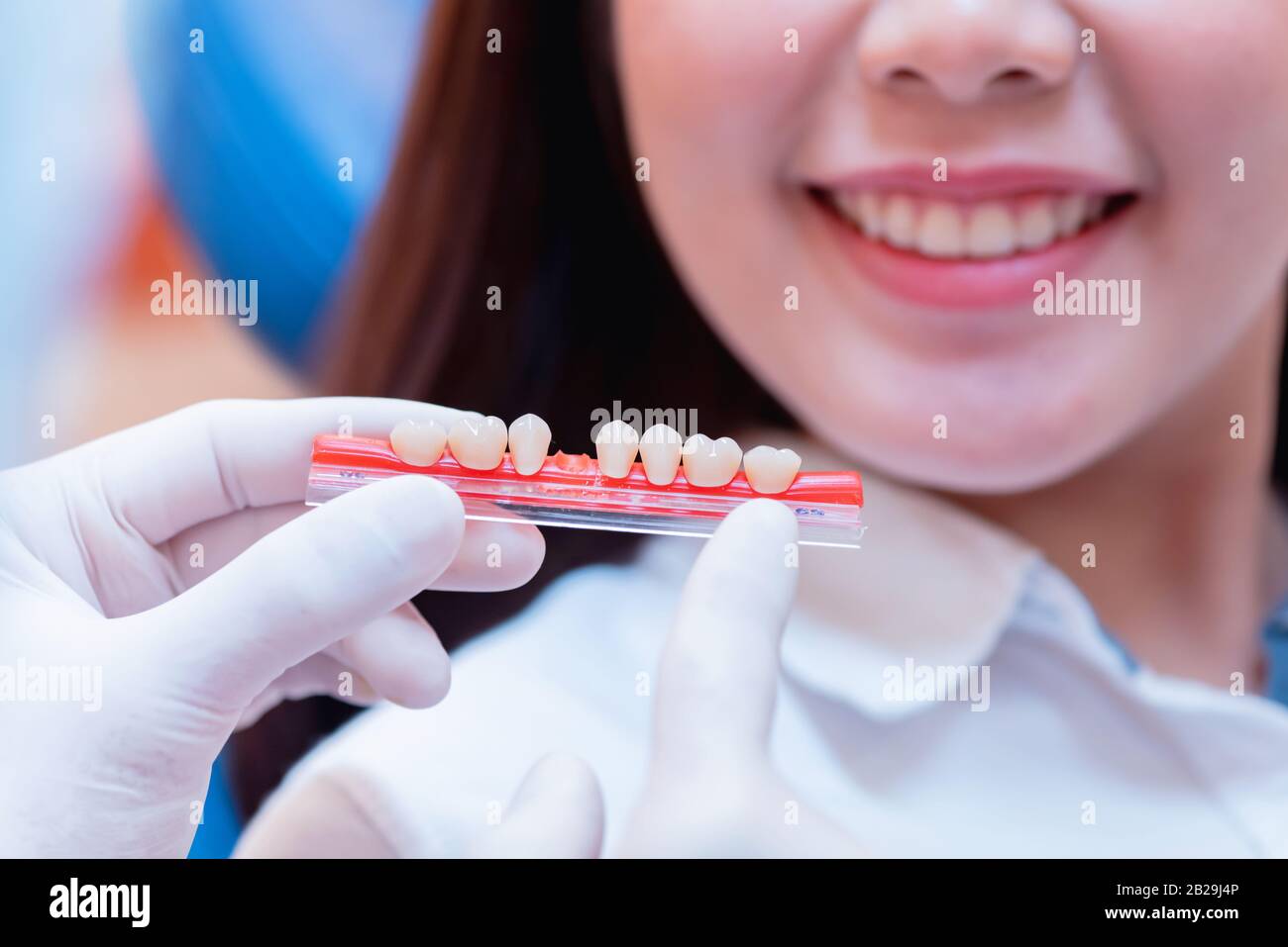 Dentist with tooth implant false teeth. Dentistry and healthcare ...