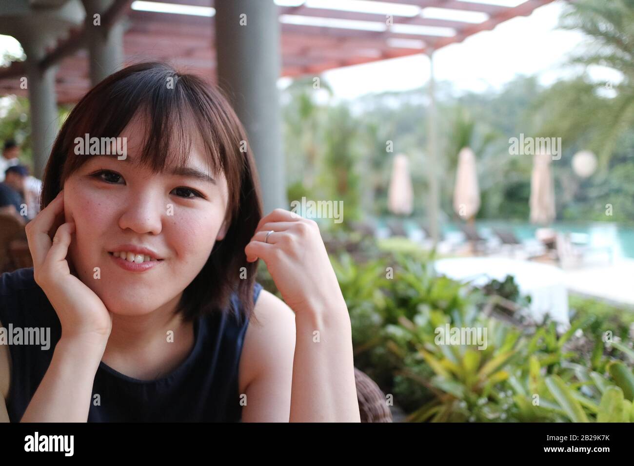Lady relaxing poolside hi-res stock photography and images - Alamy