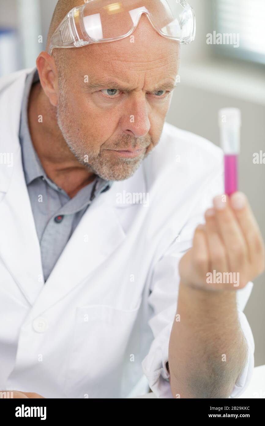 Scientist examining test tube hi-res stock photography and images - Alamy