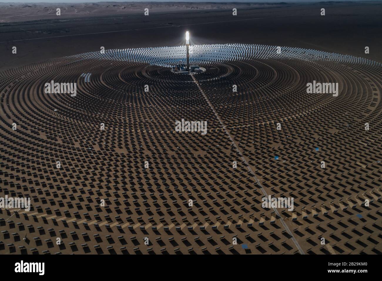 Aerial view of solar thermal plant uses mirrors that focus the sun's ...
