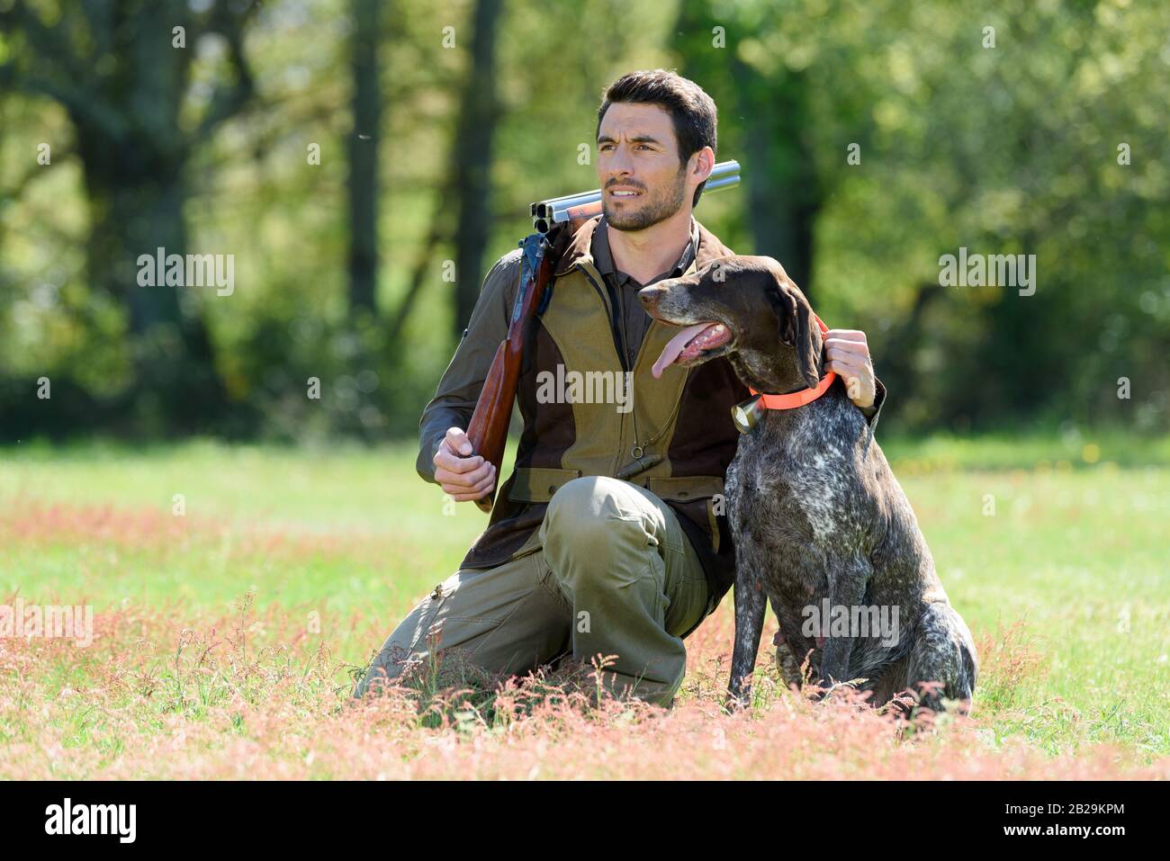 portrait of hunter with his dog Stock Photo - Alamy