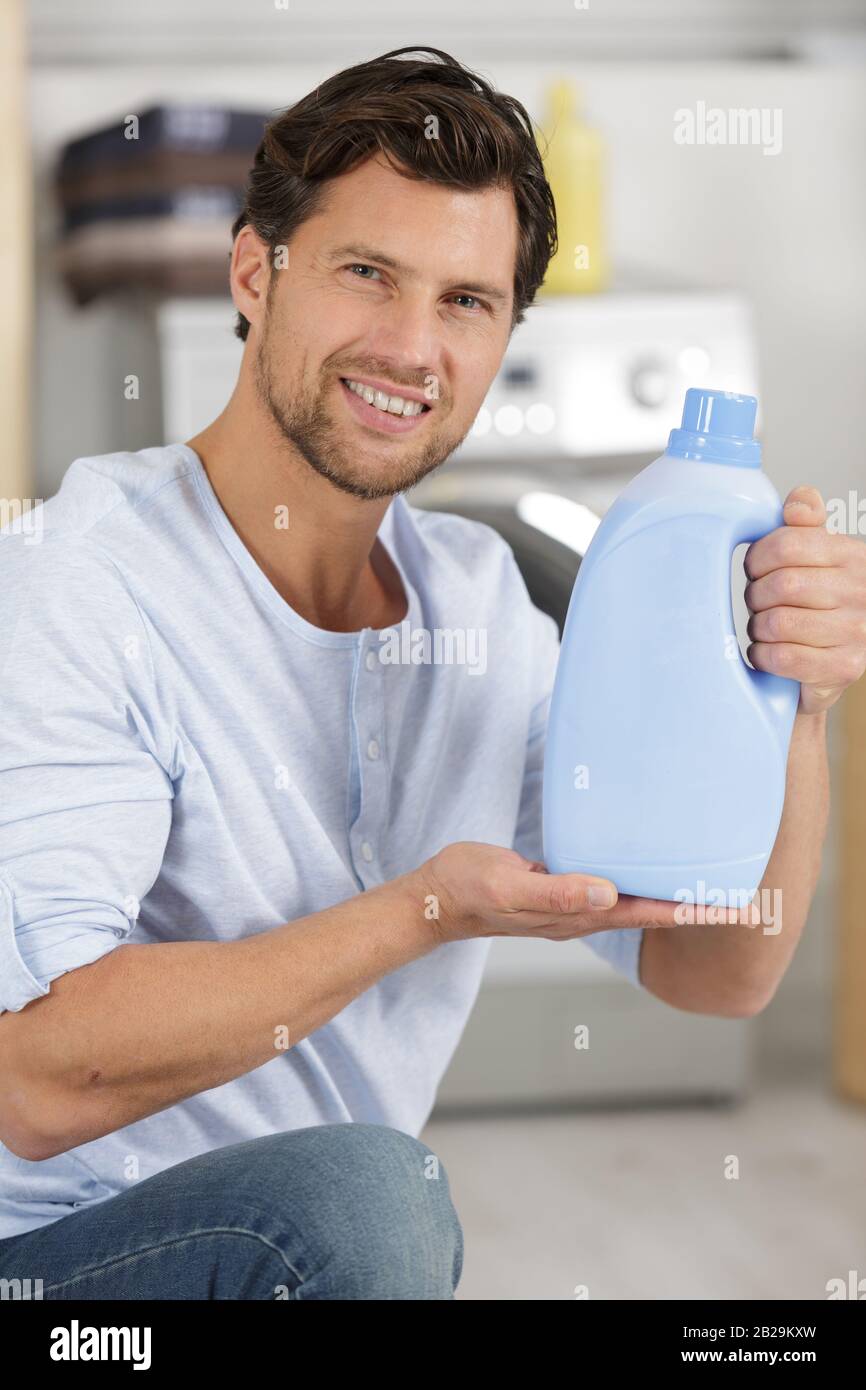Man pouring detergent washing hi-res stock photography and images - Alamy