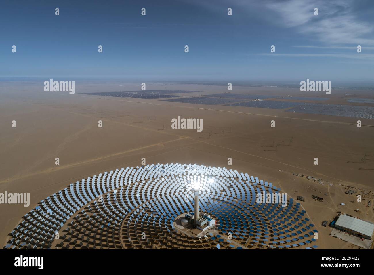 Aerial view of solar thermal plant uses mirrors that focus the sun's ...