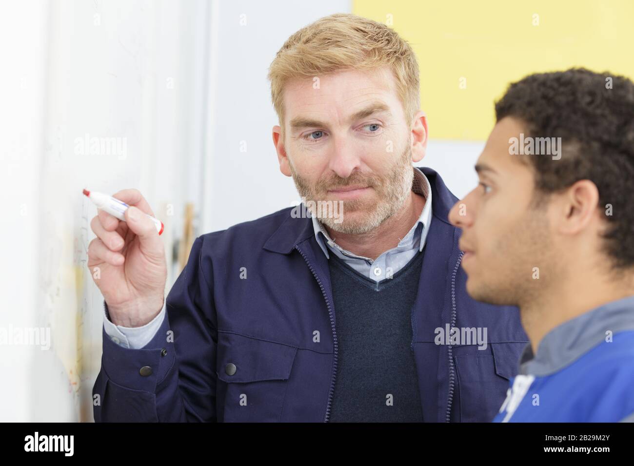 engineer writing on the board Stock Photo - Alamy
