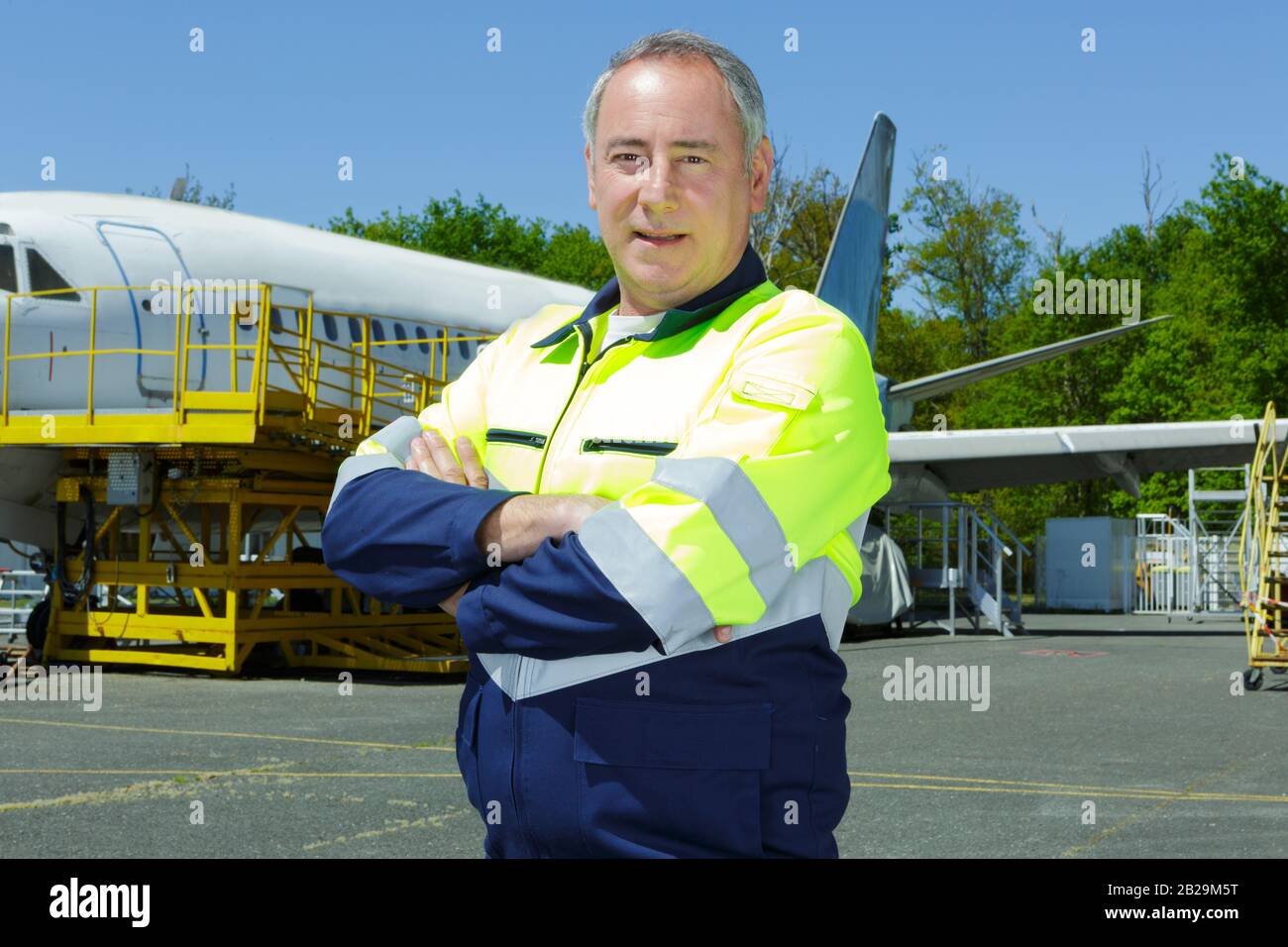 an aircraft assembling manager posing Stock Photo - Alamy