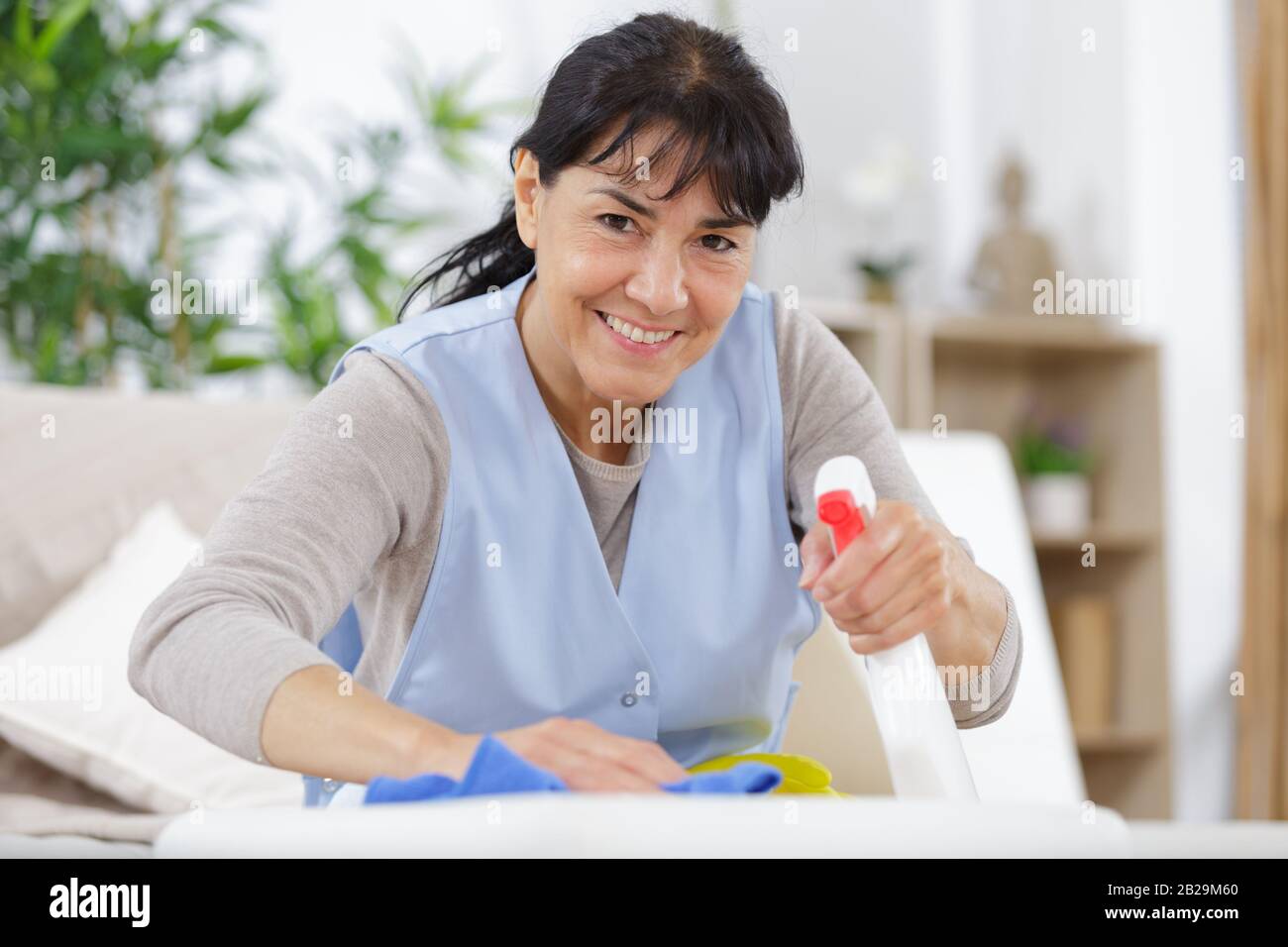 Mature woman sweeping cleaning hi-res stock photography and images - Alamy