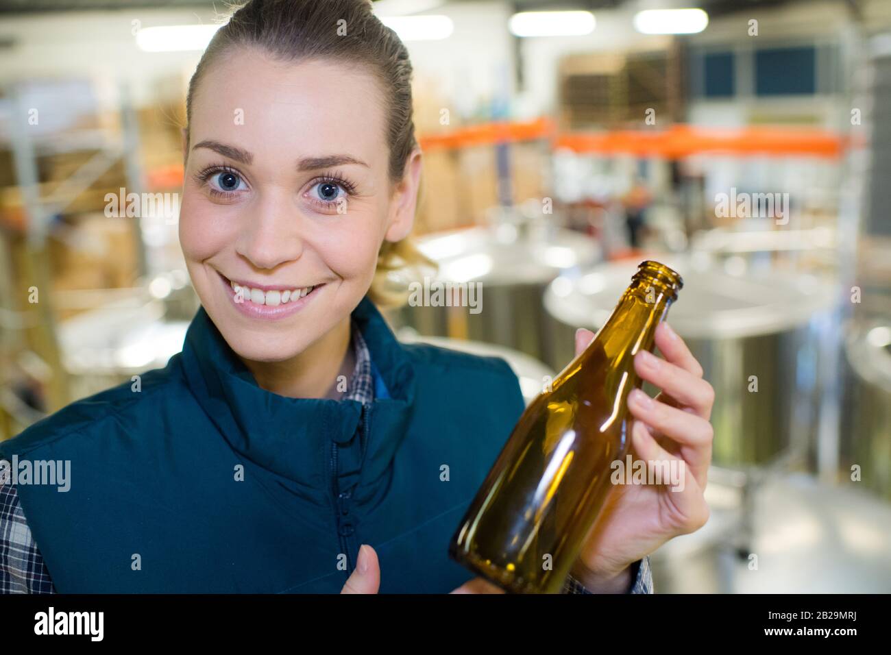 portrait of happy female brewer Stock Photo - Alamy
