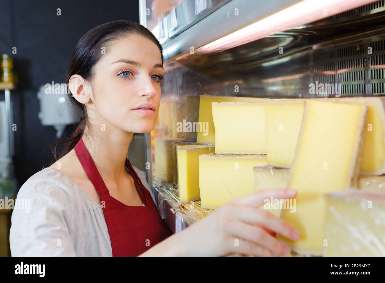 Shopkeeper saleswoman smiling hi-res stock photography and images - Alamy
