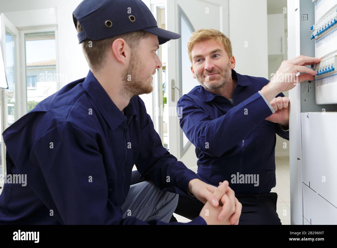 technicians stand in industrial environment Stock Photo - Alamy