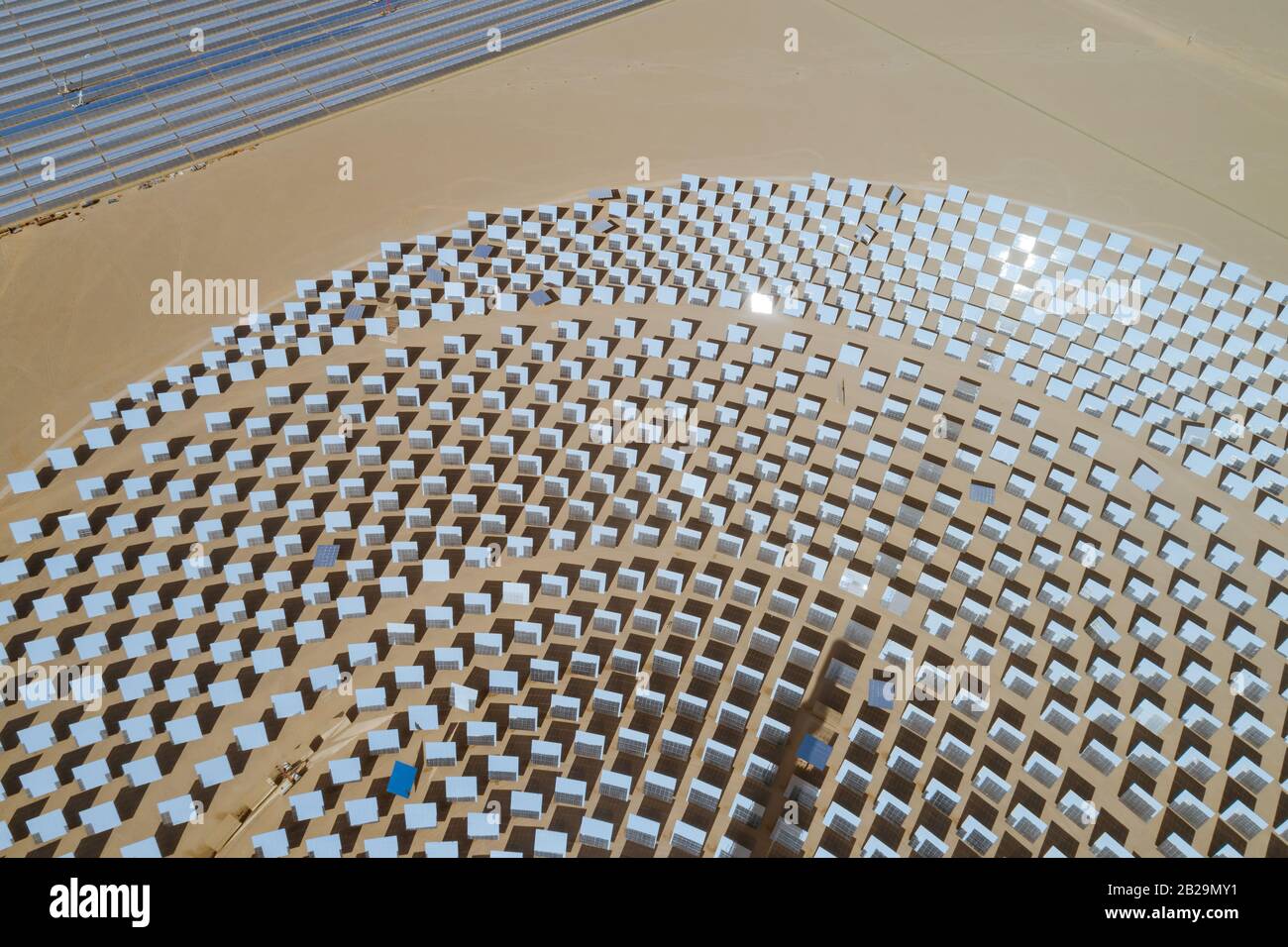 Aerial view of solar thermal plant uses mirrors that focus the sun's ...