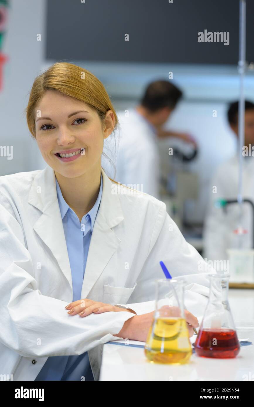 happy young female lab worker Stock Photo - Alamy