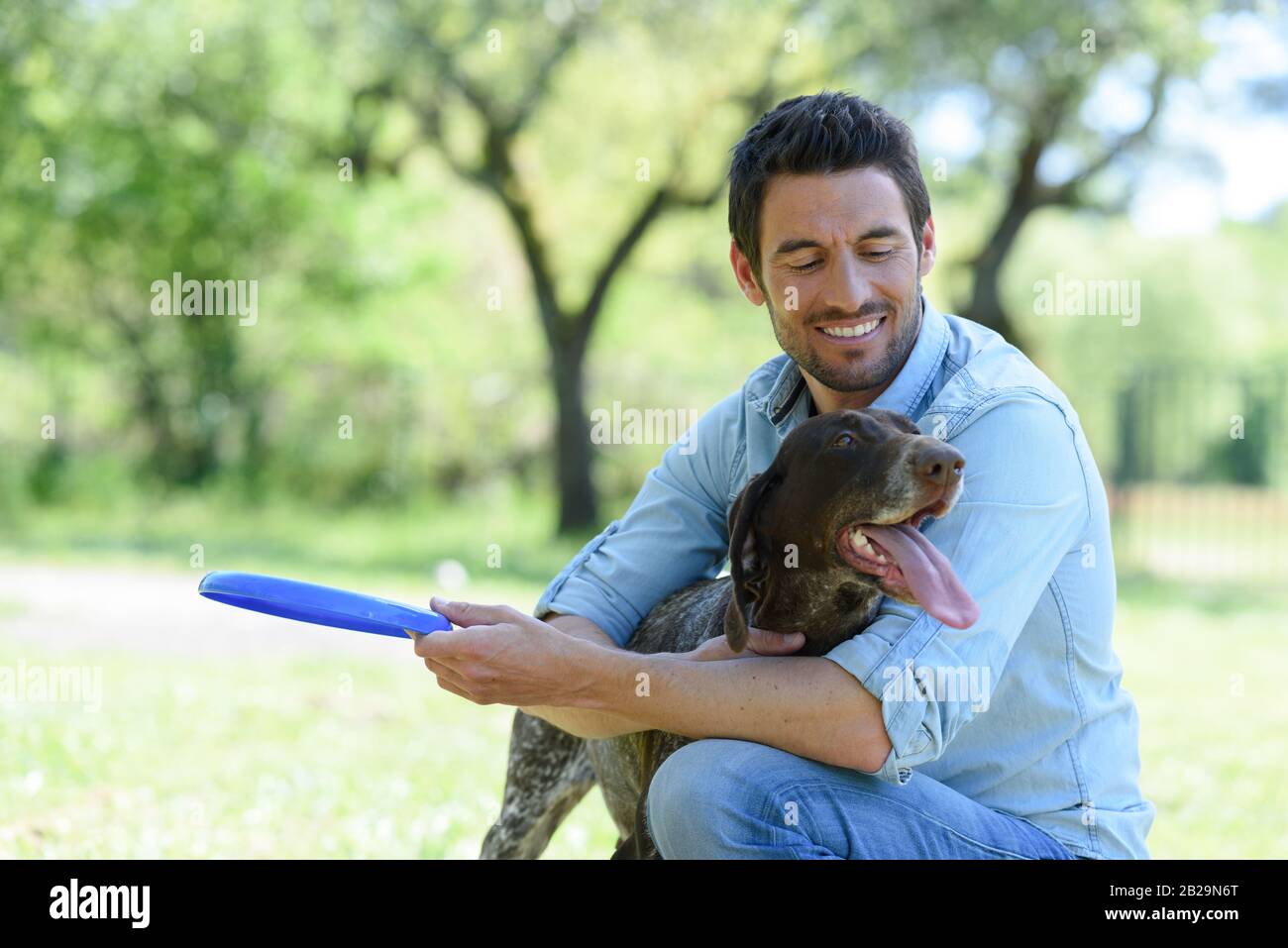 portrait of happy man with dog Stock Photo - Alamy