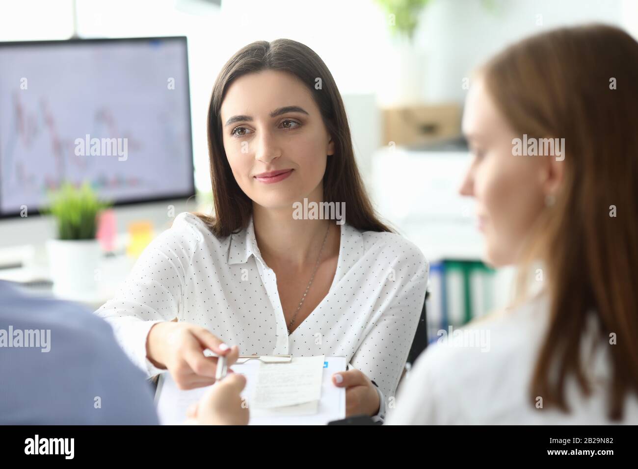 Smart woman at negotiations Stock Photo - Alamy