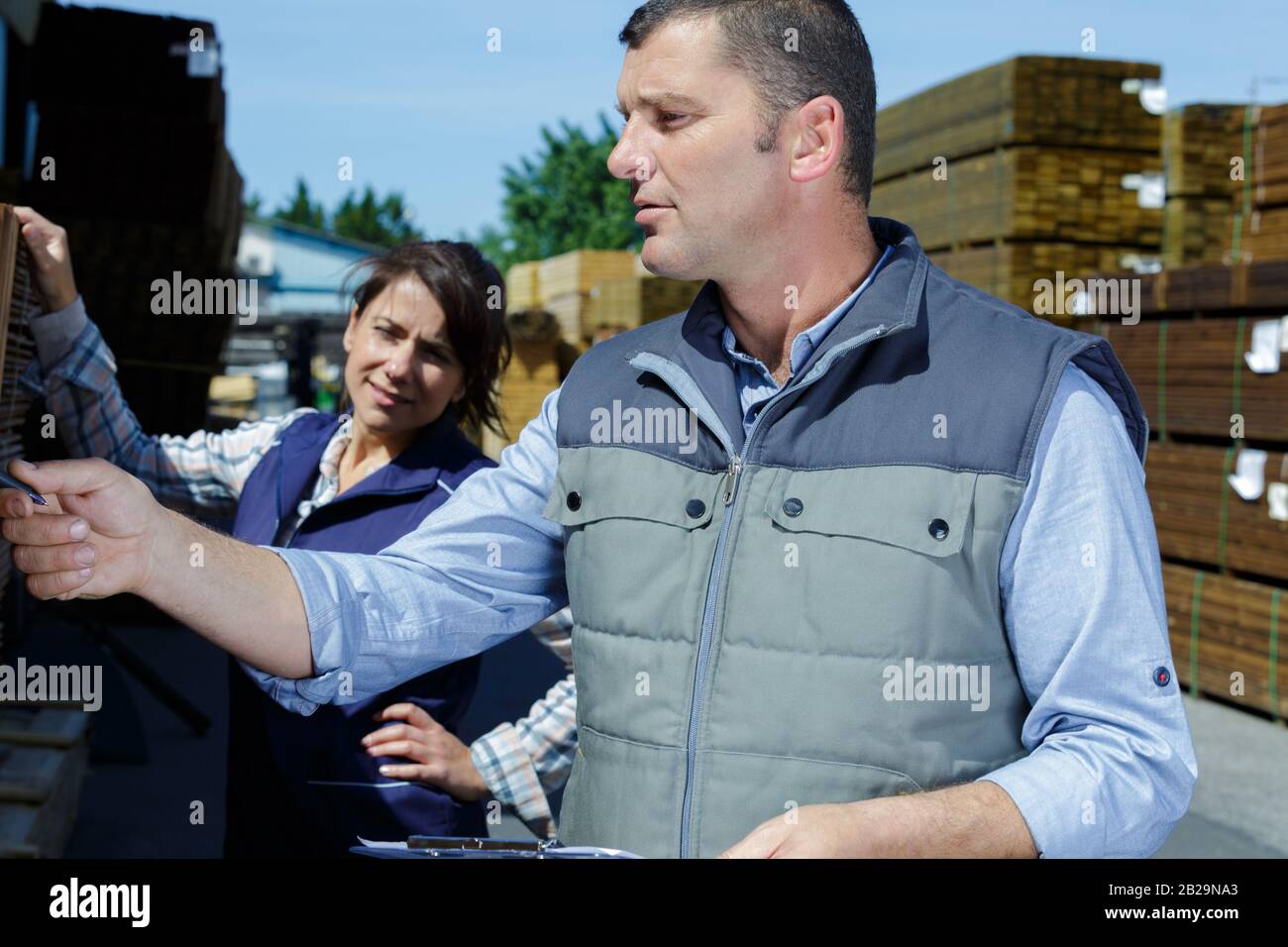 warehouse employees of woods controlling the merchandise outdoors Stock ...