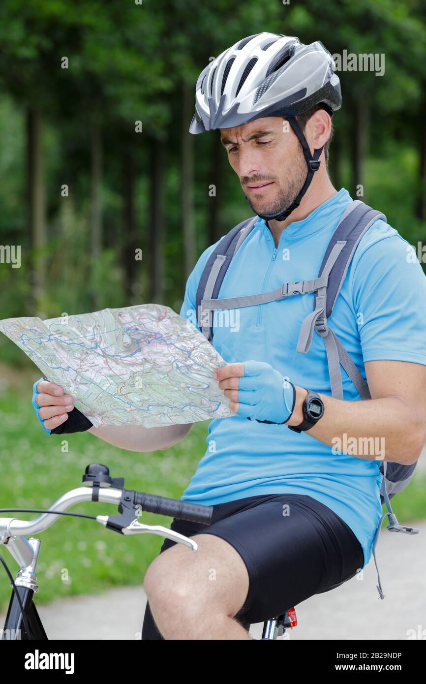 male rider holding a map Stock Photo - Alamy