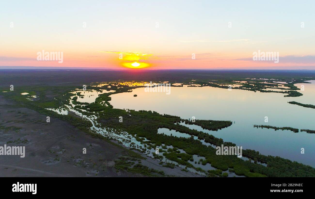 Aerial view of The Ailik Lake during sunset with colorful light. The ...