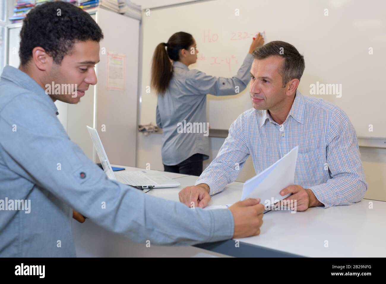 teacher awaiting answer from male student Stock Photo - Alamy