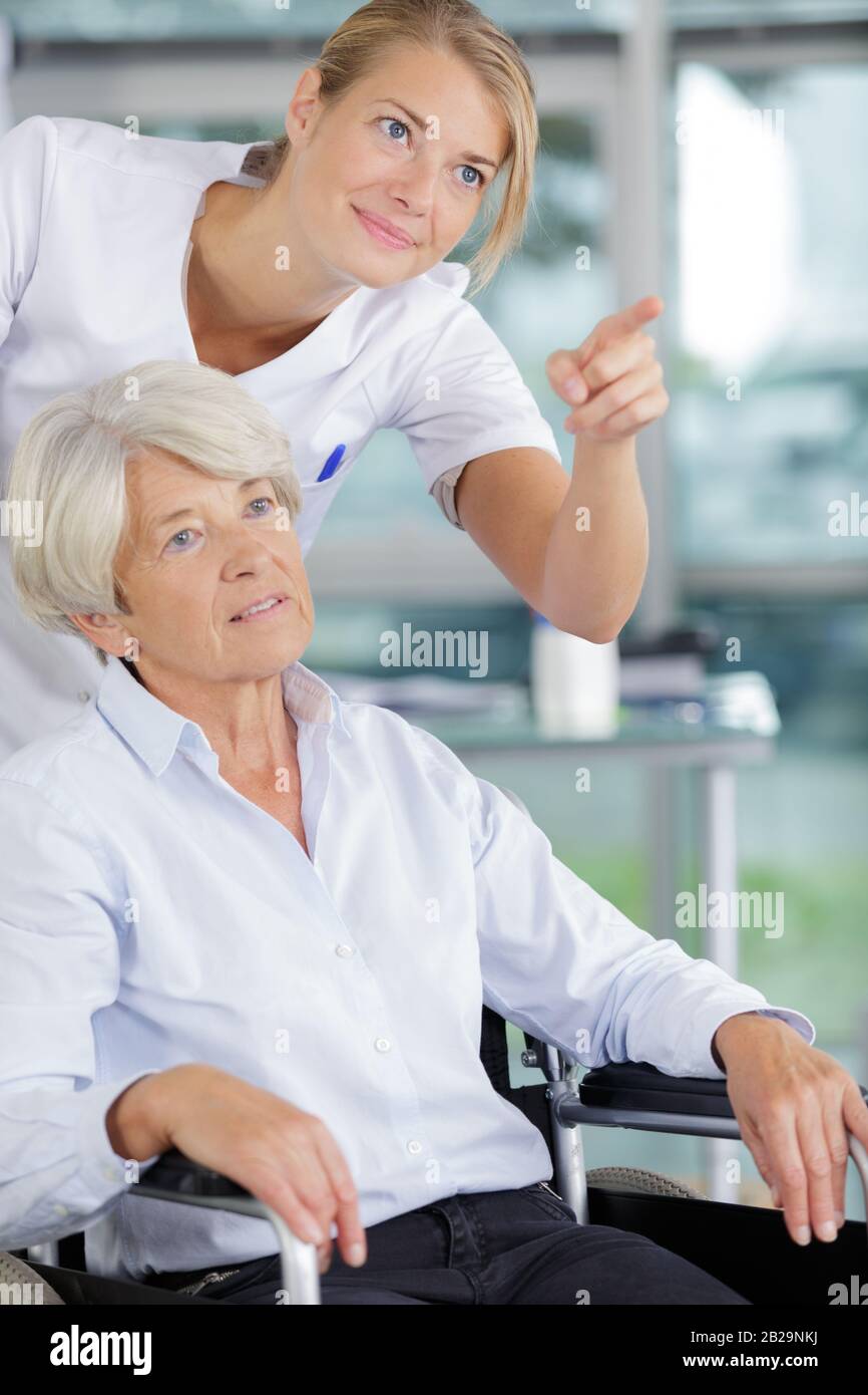 Nurse helping woman stand up hi-res stock photography and images - Alamy