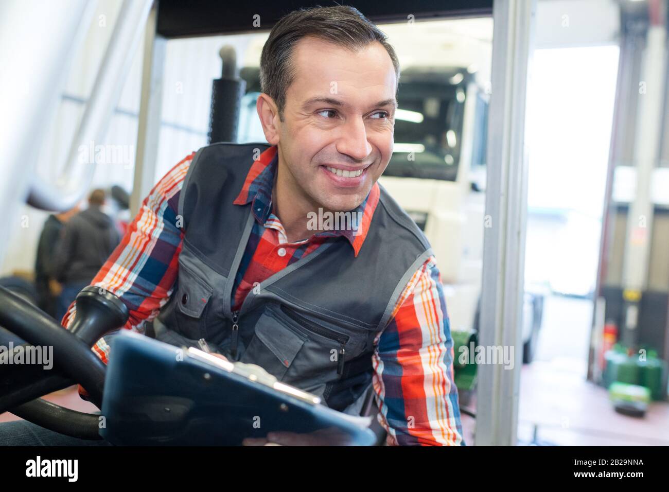 double glazing glass factory worker operating forklift Stock Photo - Alamy