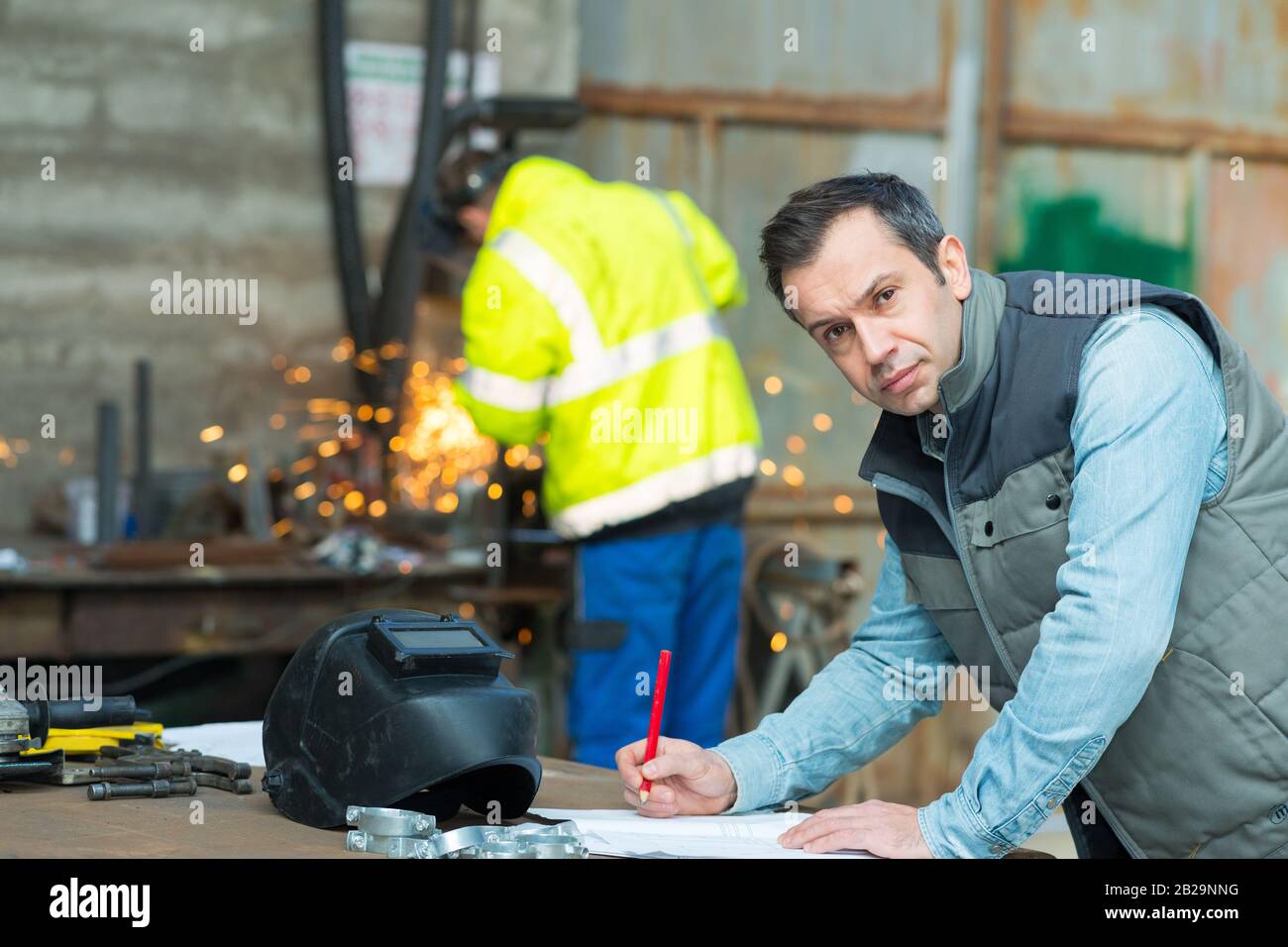 a steel factory supervisor posing Stock Photo - Alamy