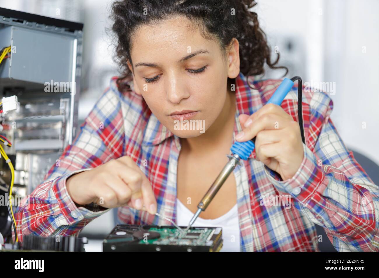 cute female engineer at home working on technology Stock Photo - Alamy