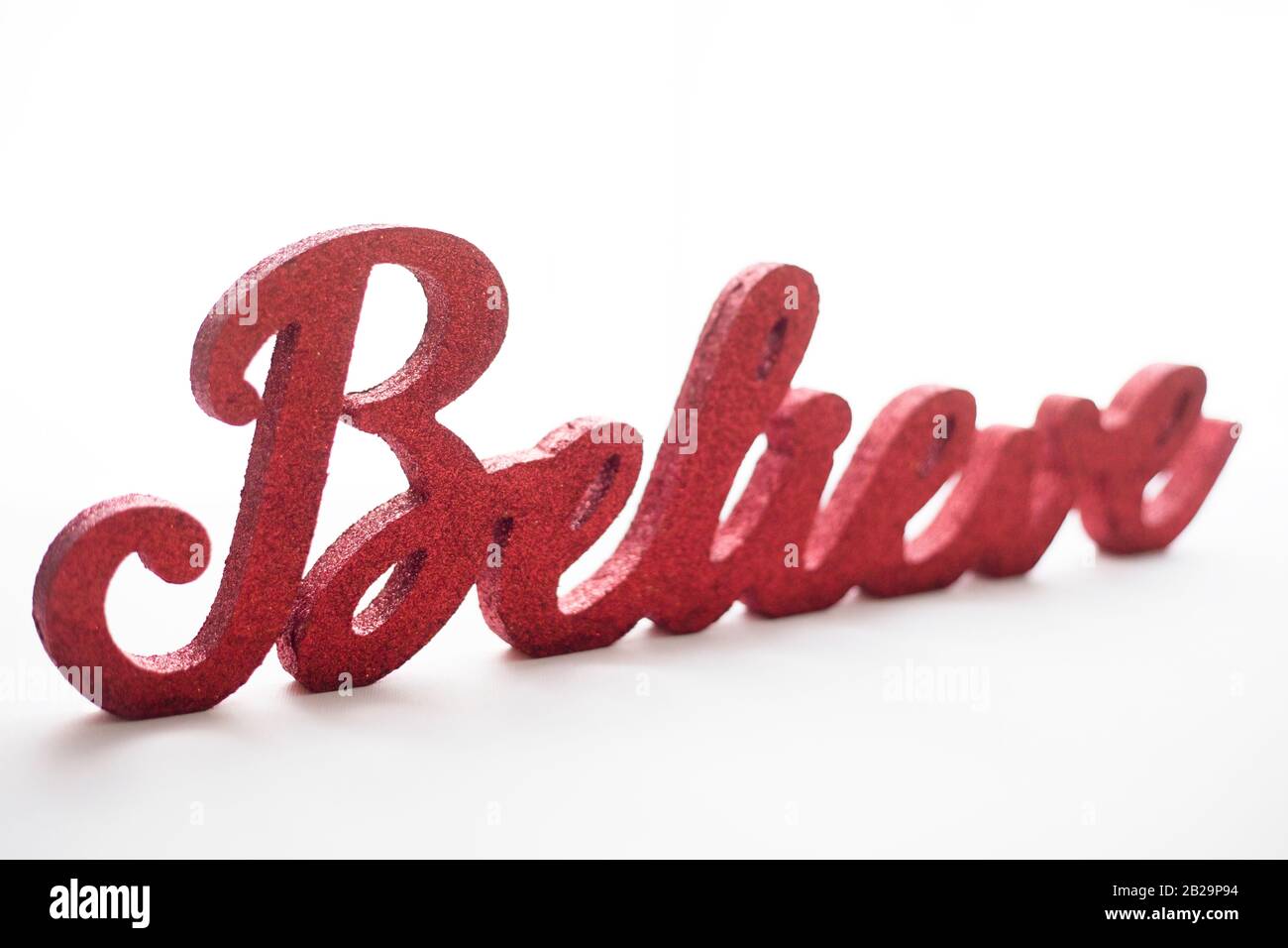 Red believe sign on white background Stock Photo - Alamy