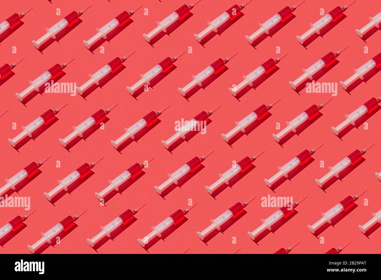 Medicinal pattern from syringes with red liquid or serum Stock Photo ...
