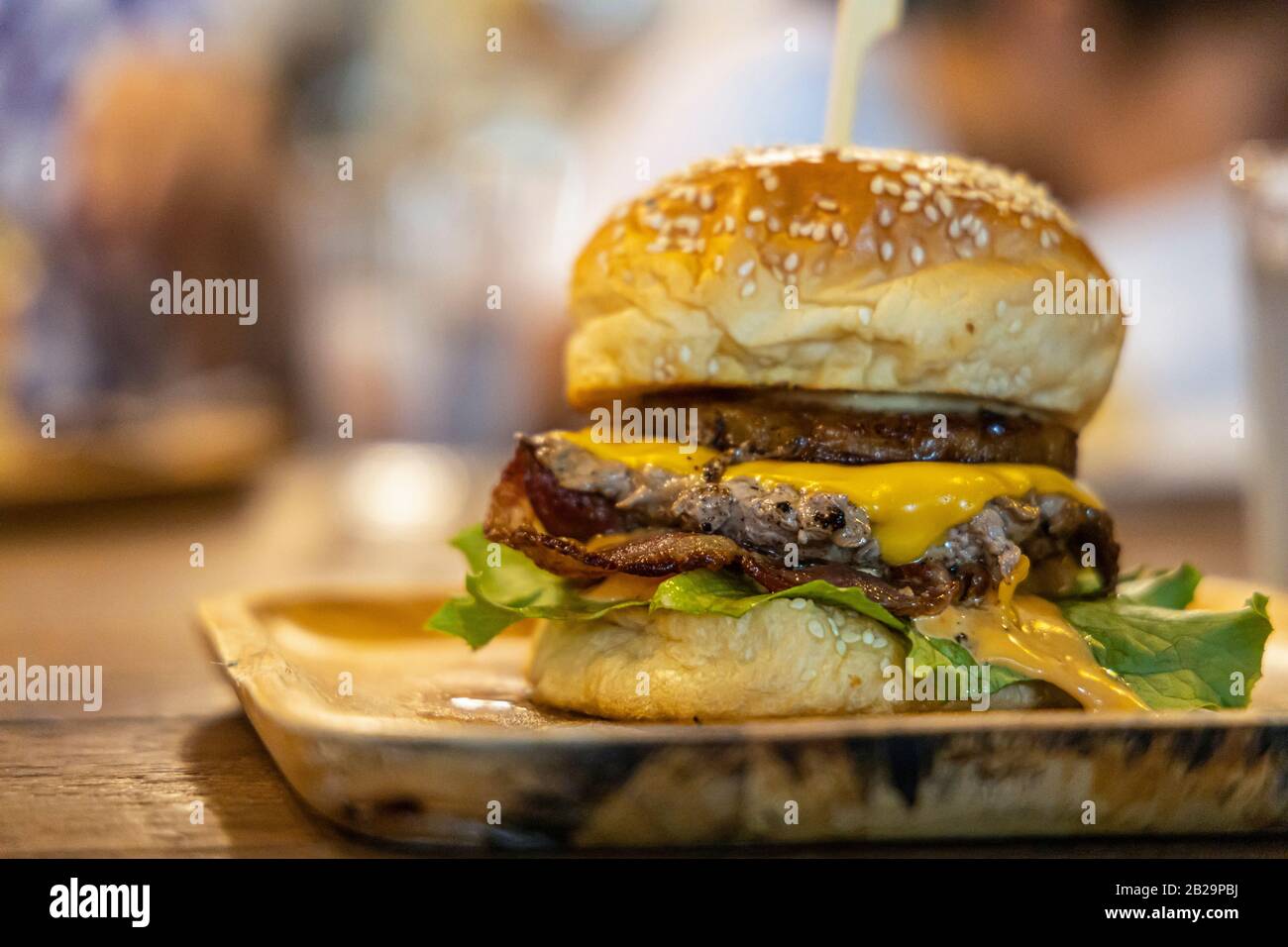 Close up beef hamberger on the wooden plate Stock Photo - Alamy