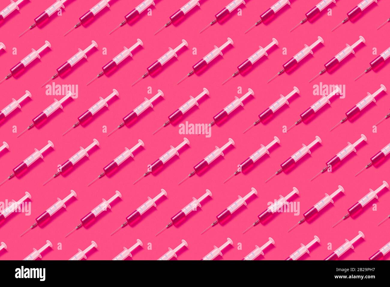 Medicinal pattern from syringes with hot pink drugs or serum Stock ...