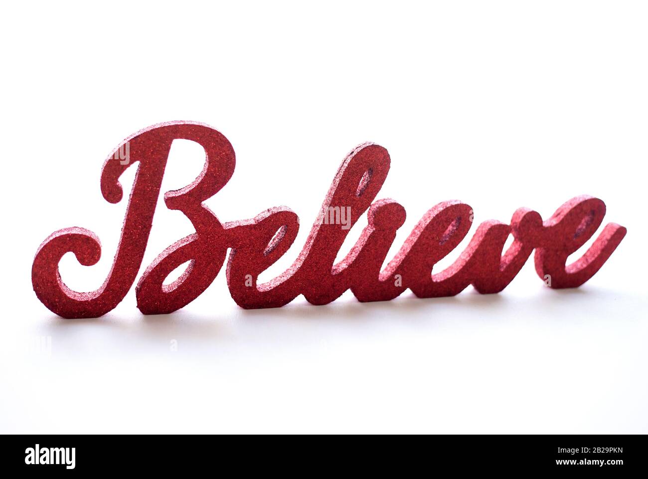 Red believe sign on white background Stock Photo - Alamy