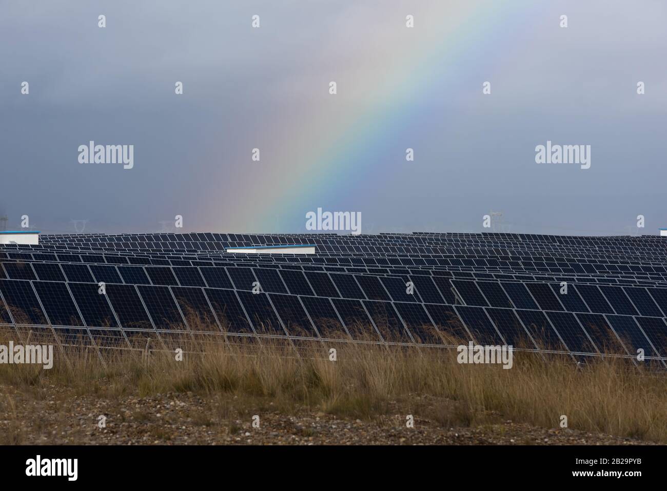 rainbow and photovoltaic panels of a solar power station Stock Photo ...
